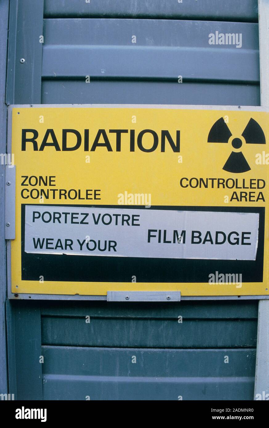 Radiation symbol and warning notice in English and French, situated on ...