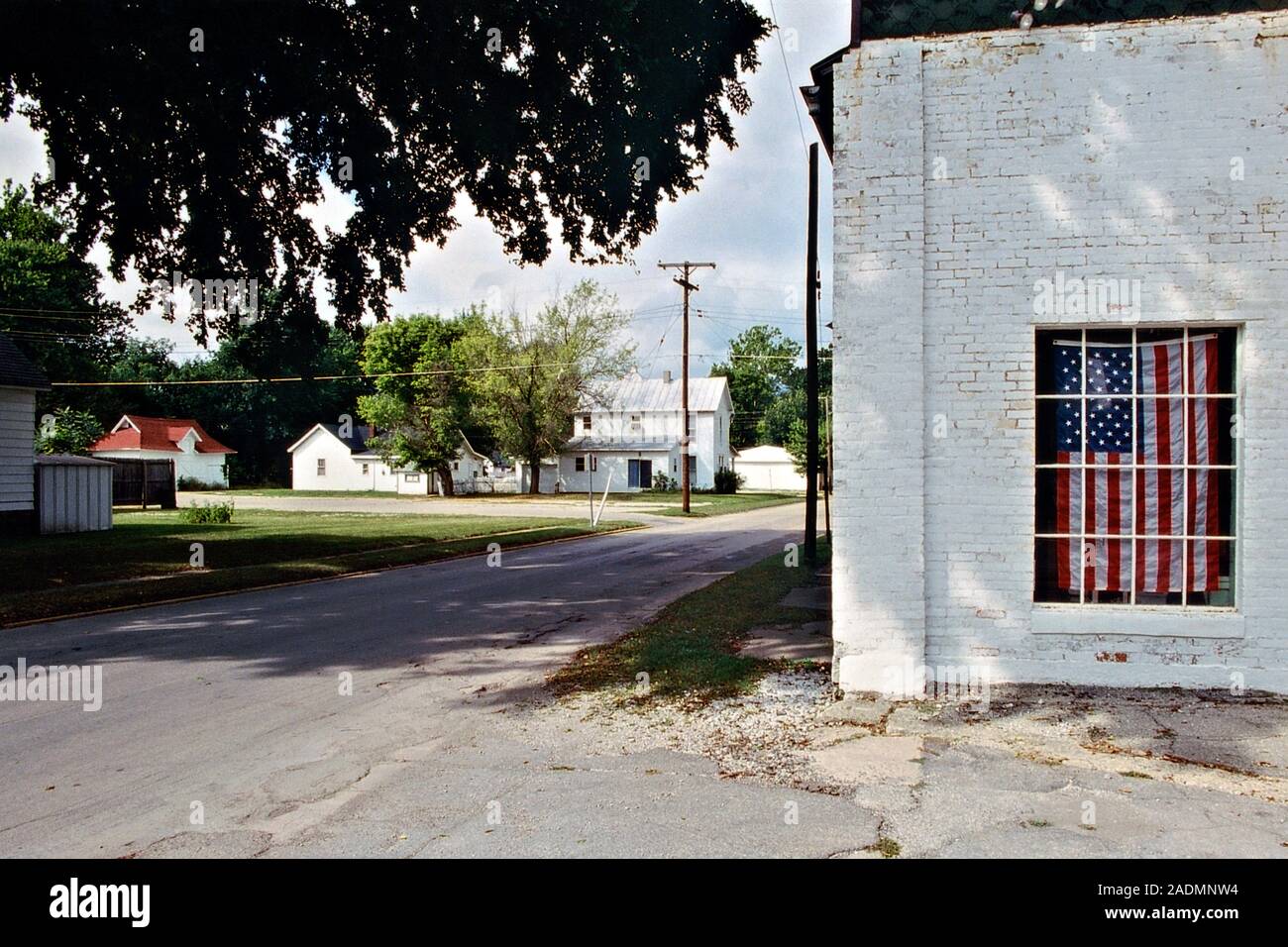 American flag hanging in automotive garage window, Fairmount, Grant ...