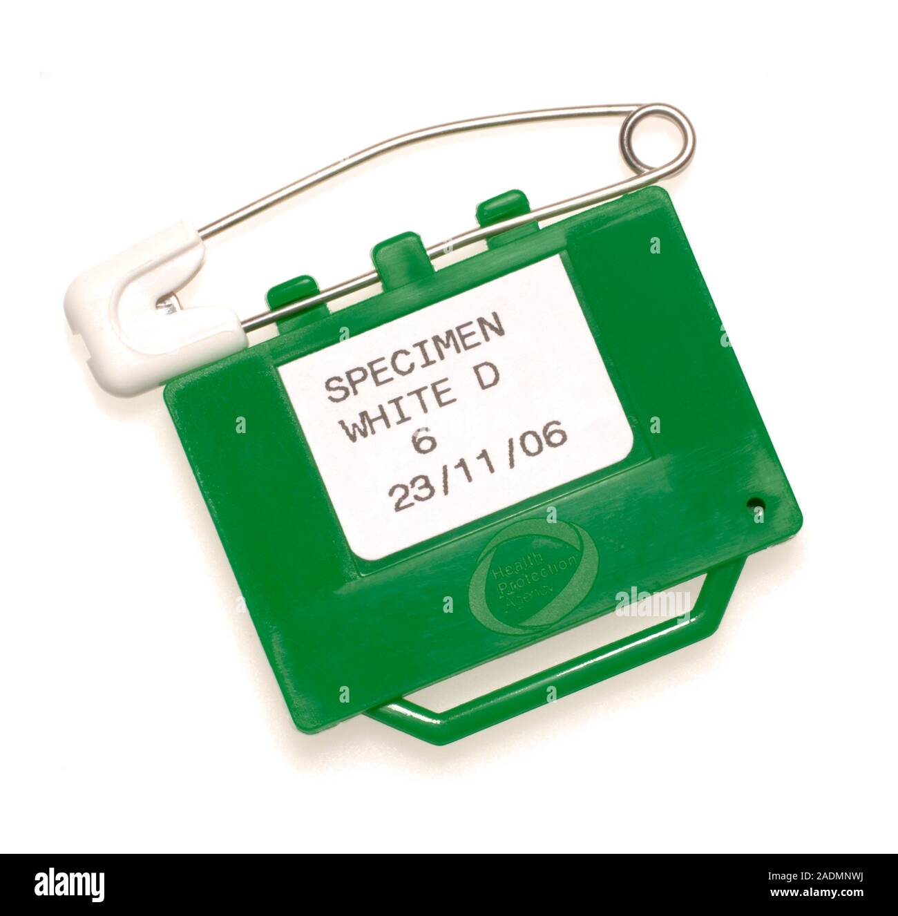 Personal neutron dose meter (dosimeter). The green casing clips ...