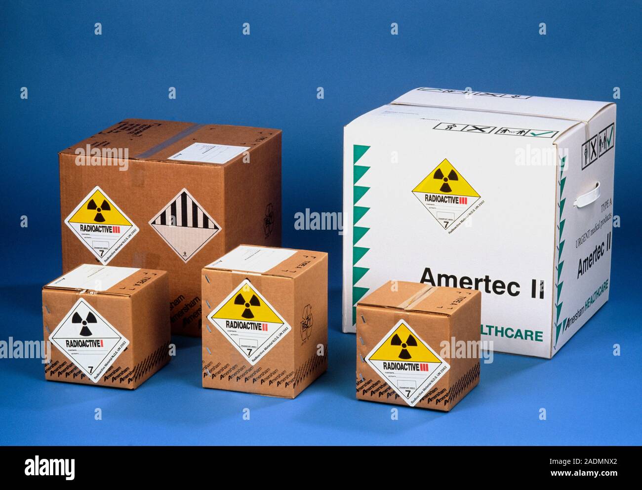 Packaging for radioactive items. Boxes with warning stickers stating ...