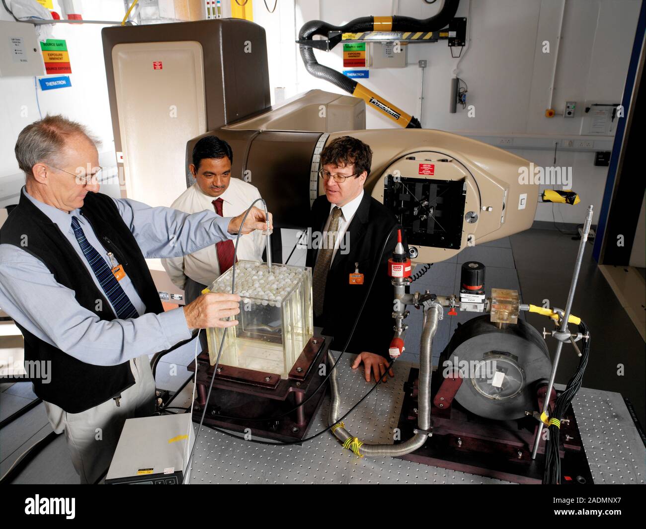 Gamma ray facility. Physicists using a cobalt-60 therapy level gamma ...
