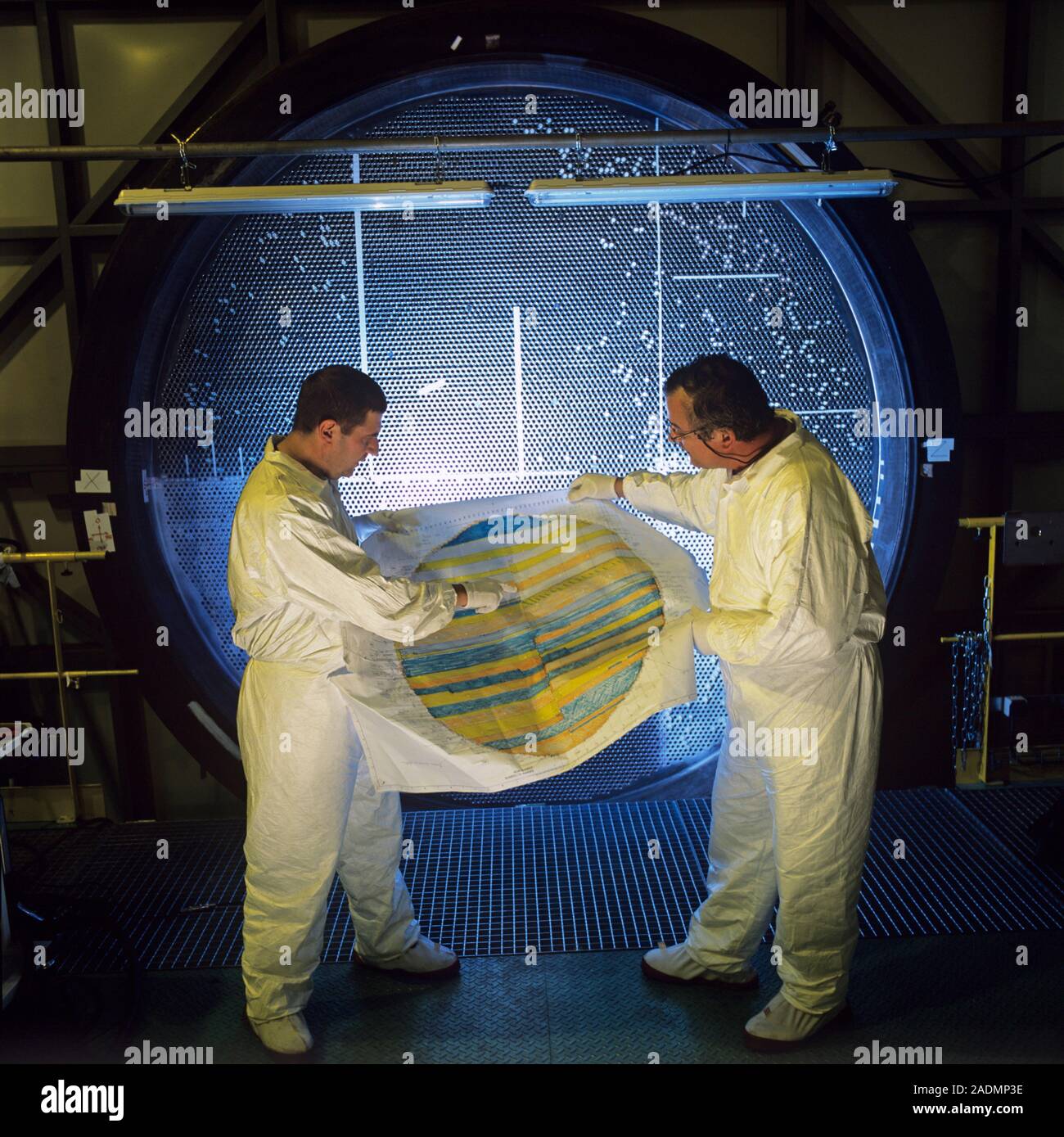 Nuclear power station construction. Workers with plans for the internal ...