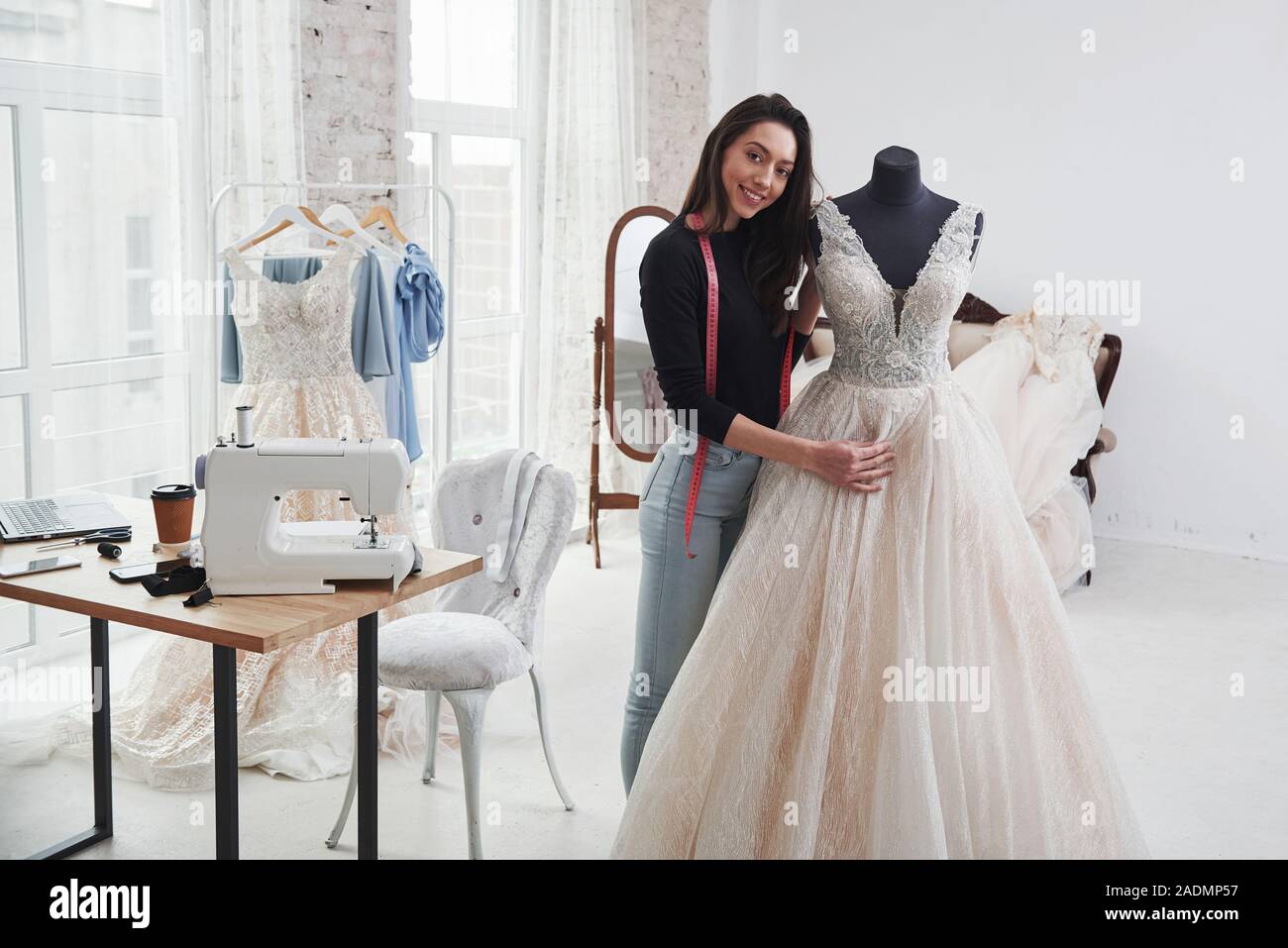 Look at her creation. Female fashion designer works on the new clothes ...