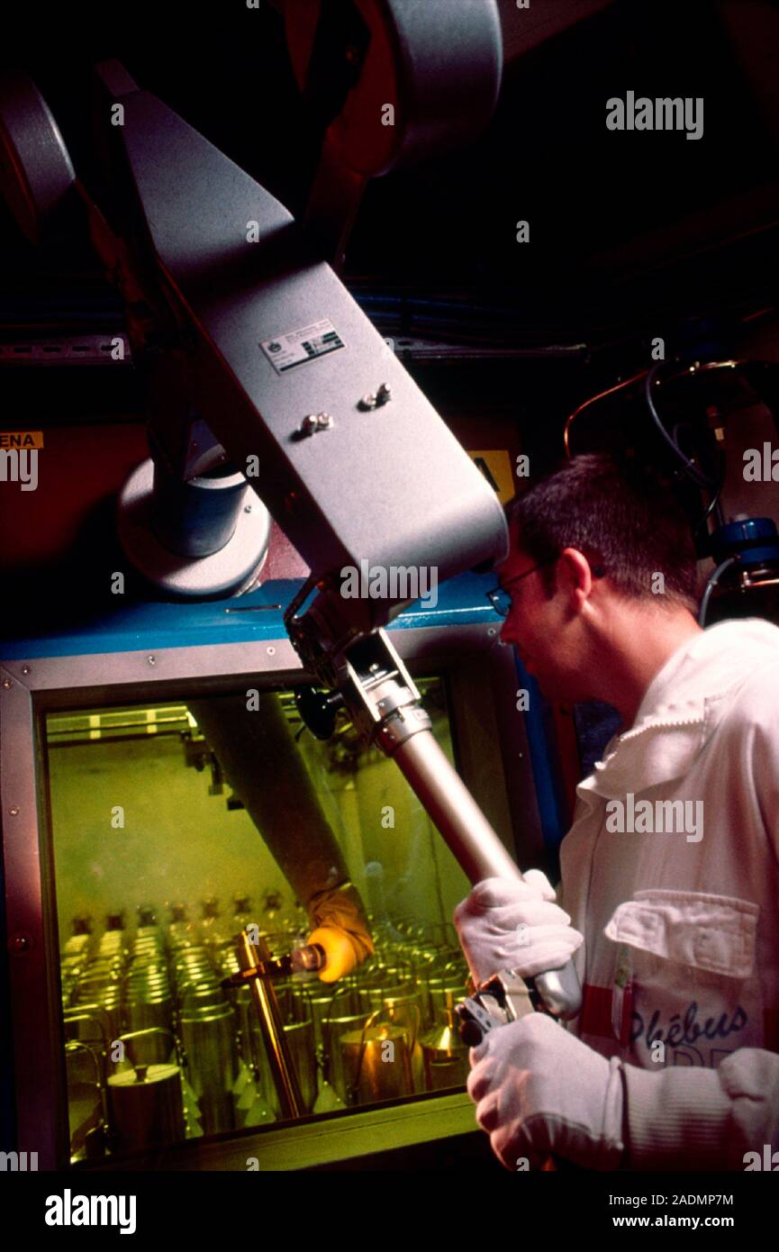 Nuclear safety research. Nuclear power station worker operating a ...
