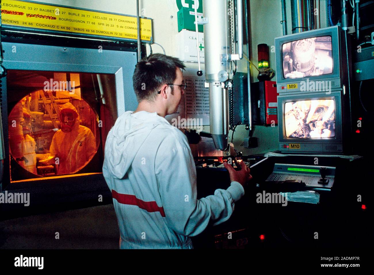 Nuclear safety research. Nuclear power station worker operating remote ...