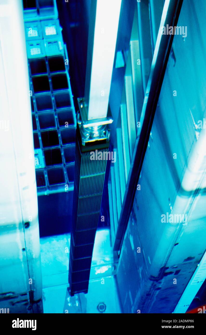 Nuclear reactor. Fuel rod being prepared for loading into a nuclear ...