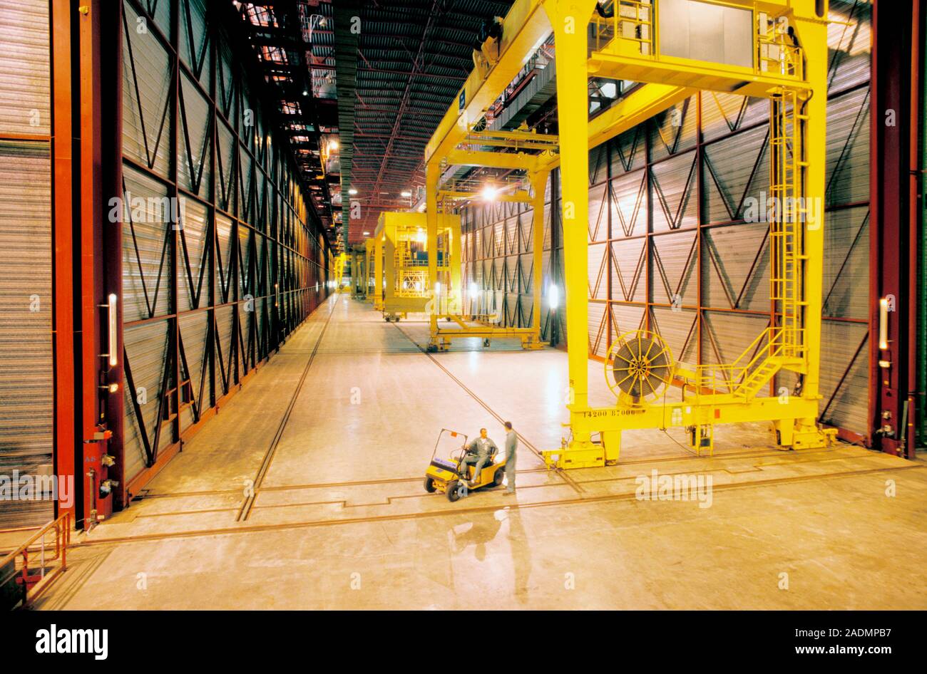 Nuclear fuel production. Workers in a factory used to enrich uranium ...