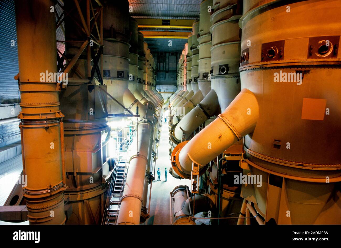 Nuclear fuel production. Gas diffusion machinery and workers in a ...