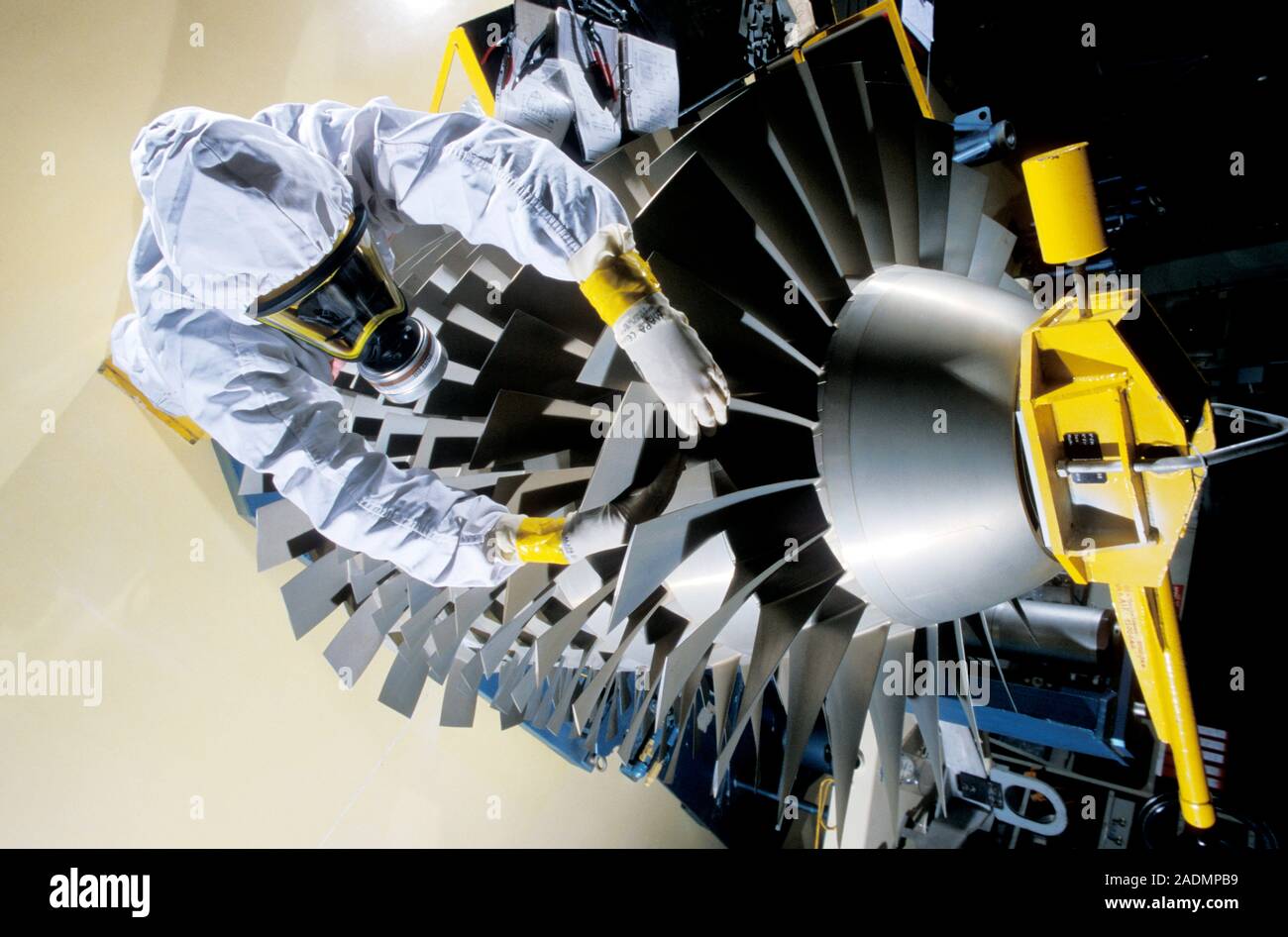 Nuclear fuel production. Worker repairing a rotor compressor for gas ...