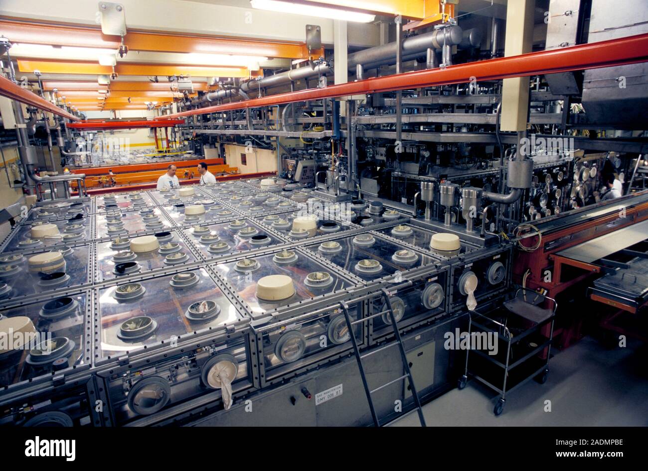 Nuclear fuel assembly. Glove boxes used to load nuclear fuel pellets ...