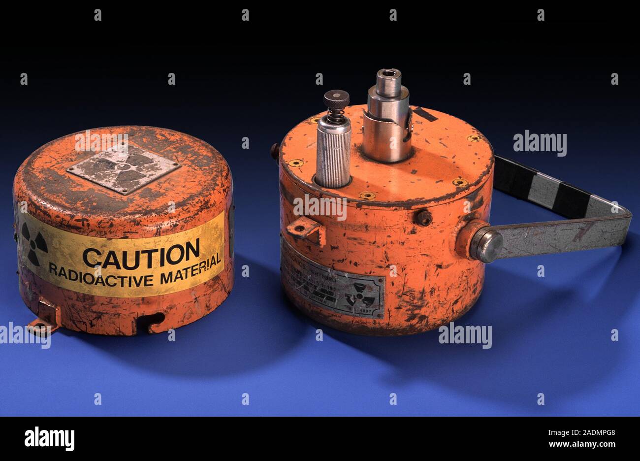 Radioactive container with a warning sticker on its lid, which has been ...