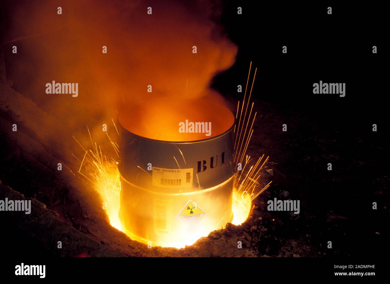 Low-level nuclear waste. Barrel of nuclear waste being burnt in an ...