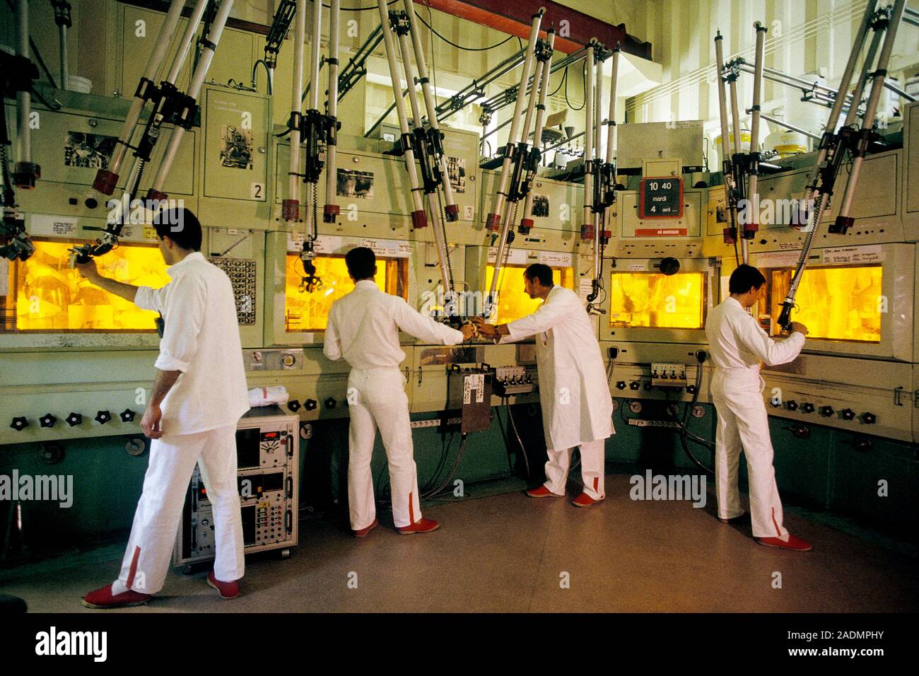 Remote handling of radioactive waste. Nuclear technicians using ...