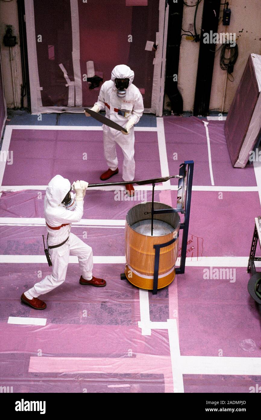 Nuclear decontamination workers. The workers are wearing sealed ...