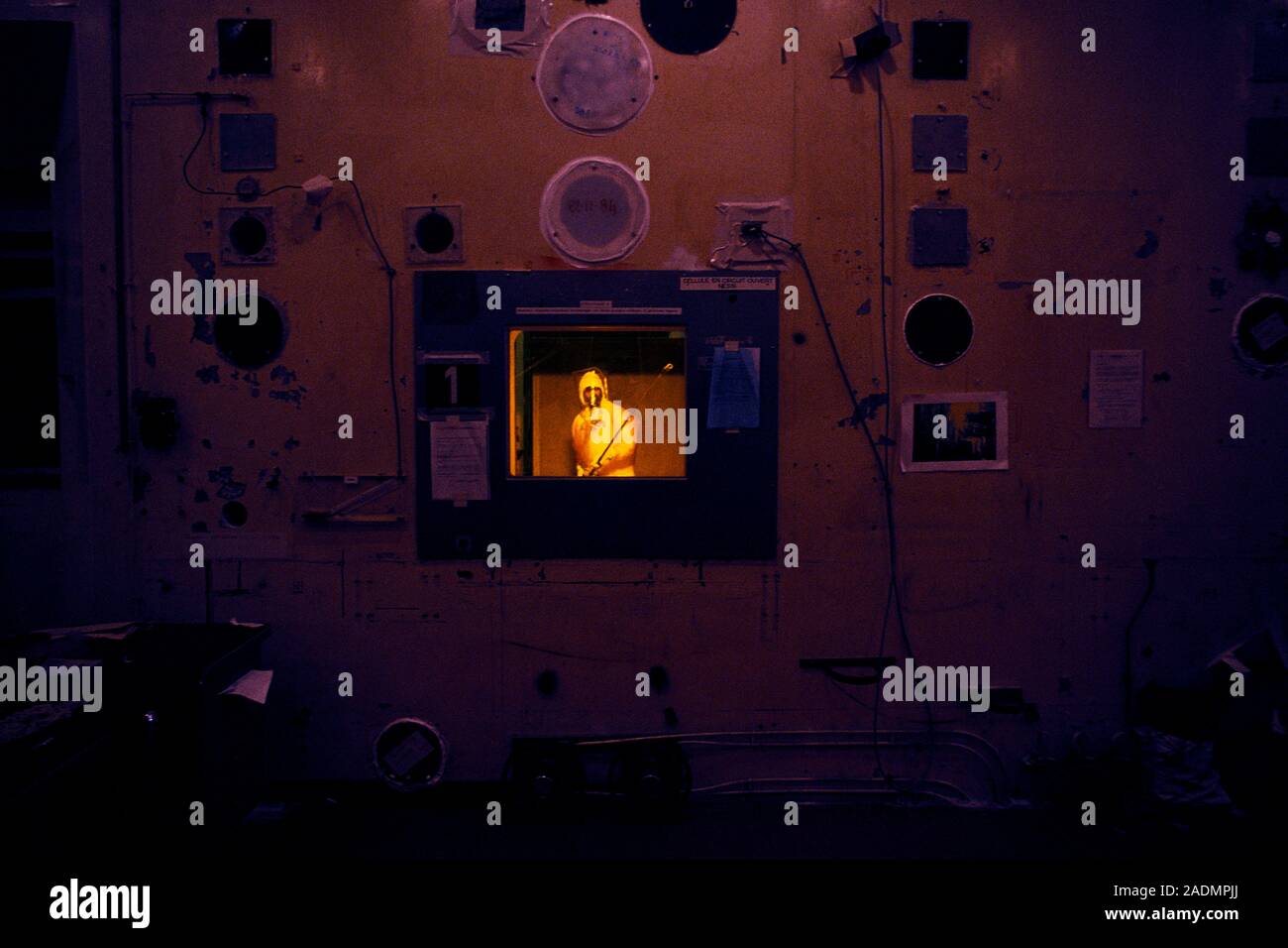 Nuclear decontamination worker clearing radioactive waste. The worker ...