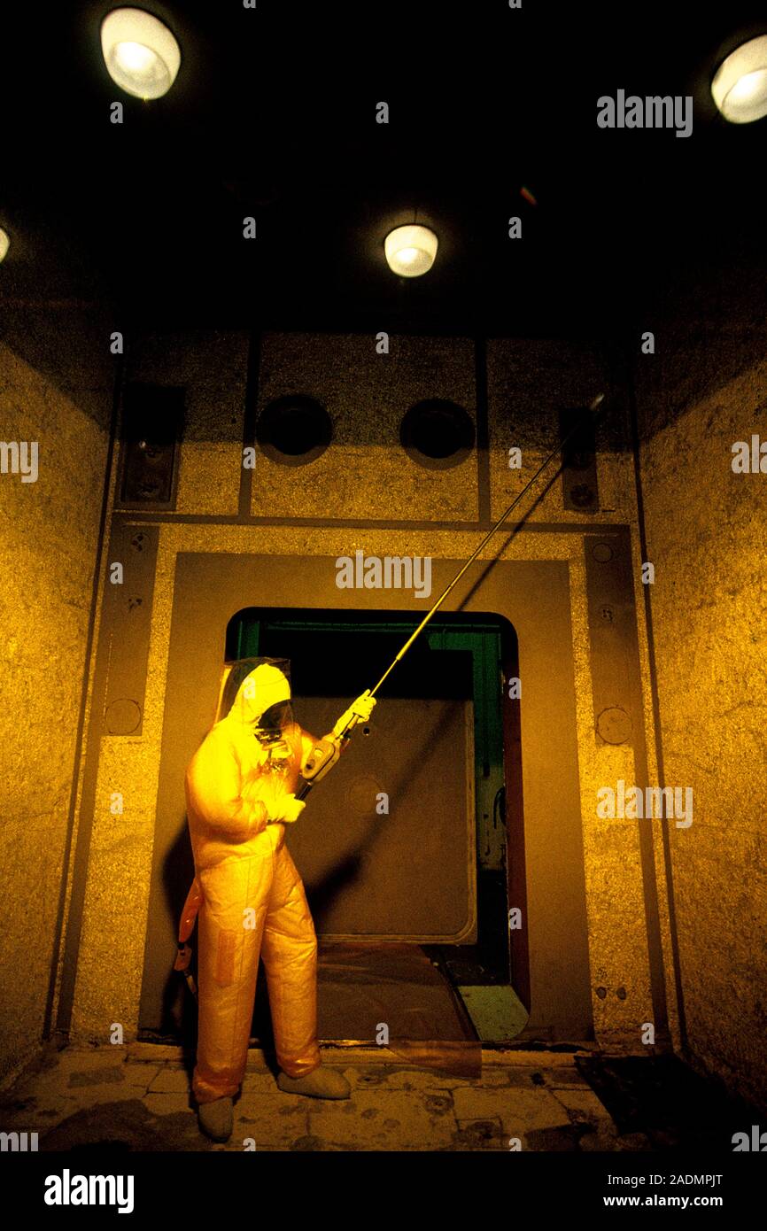 Nuclear decontamination worker using a Geiger counter to check ...