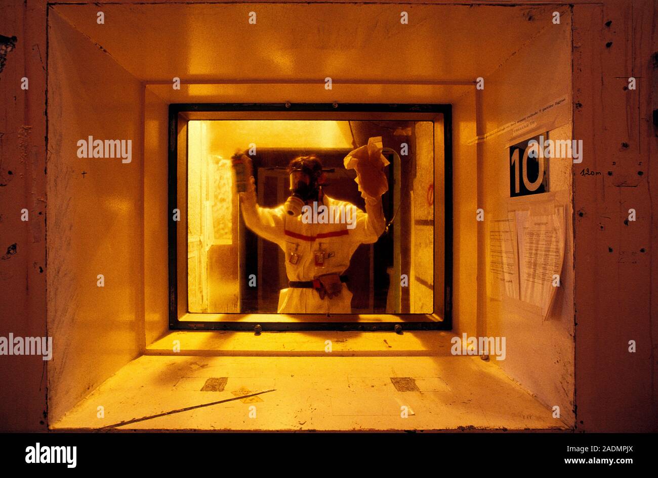 Nuclear decontamination worker. The worker is wearing a sealed ...