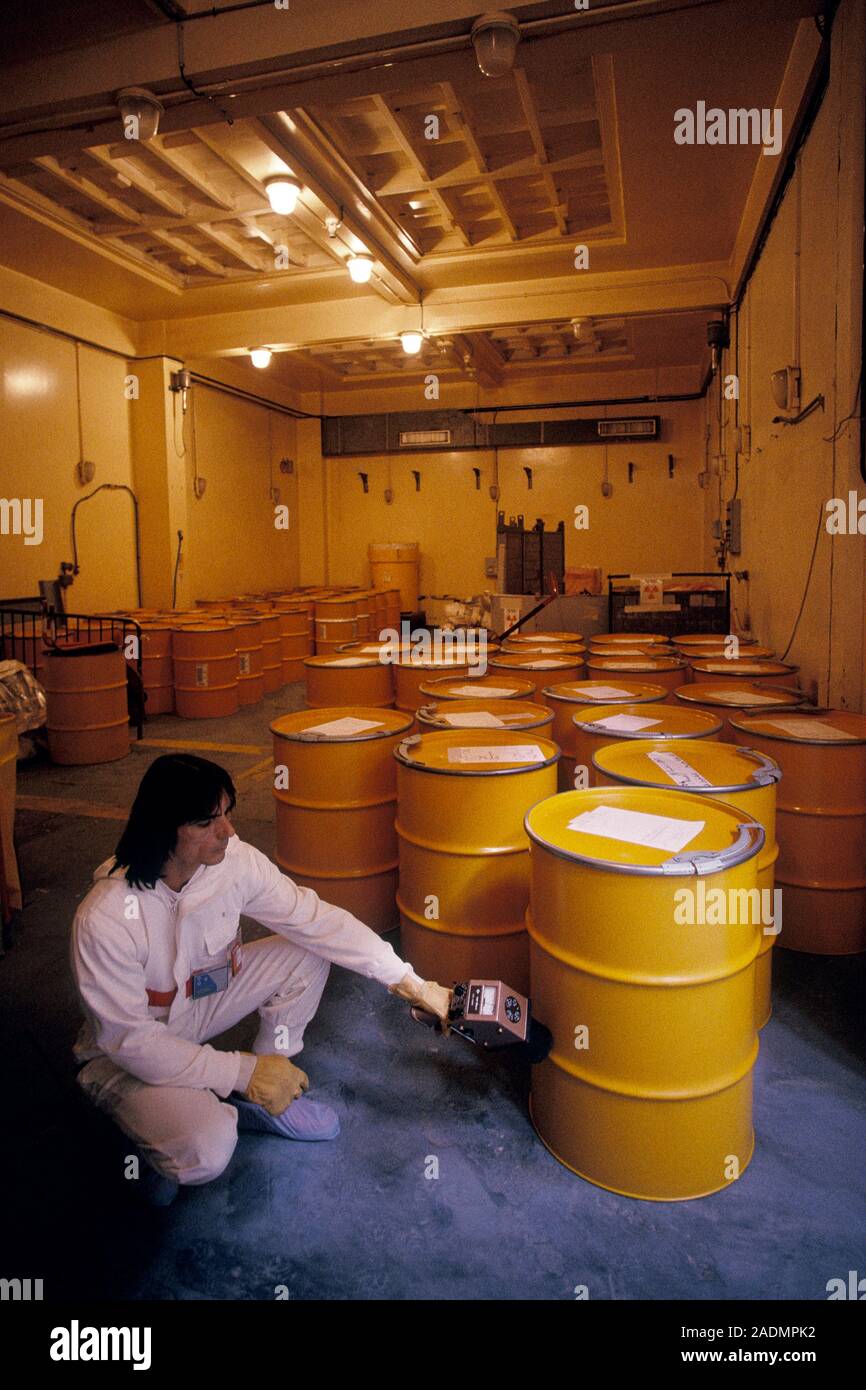 Nuclear decontamination worker using a Geiger counter to check ...