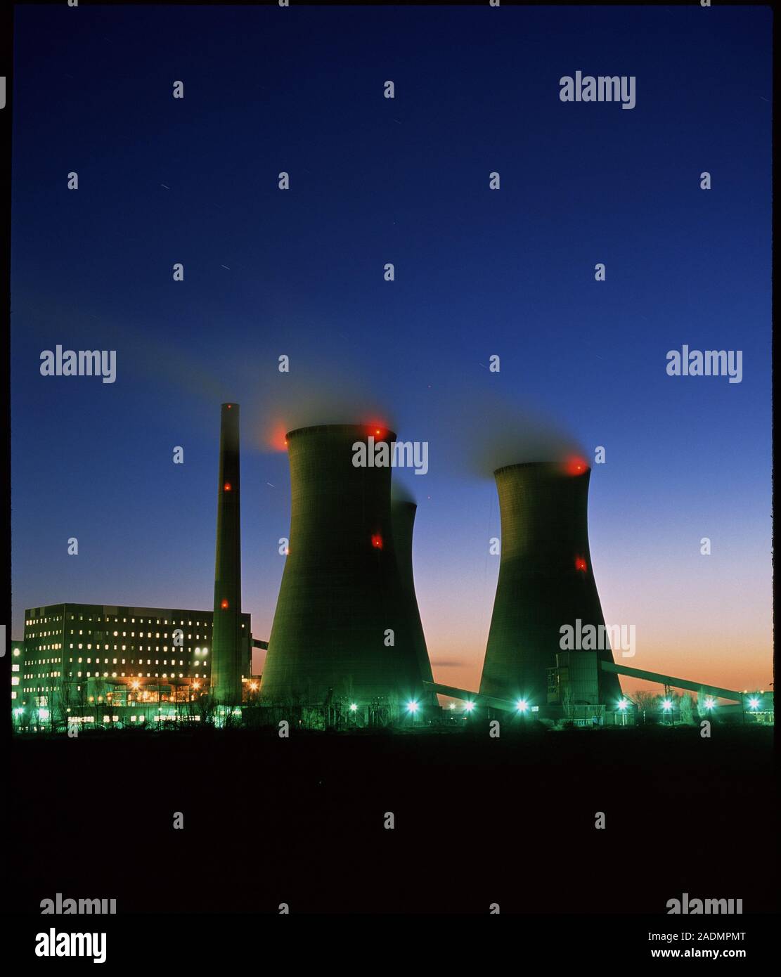 Night-time view of an oil-fired power station. Photographed at ...