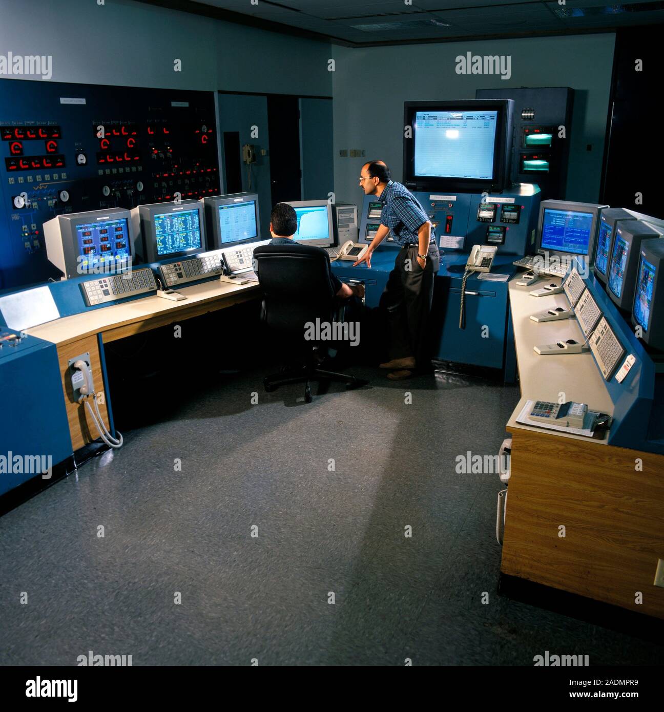 Power station control room. Technicians in the control room of a coal ...