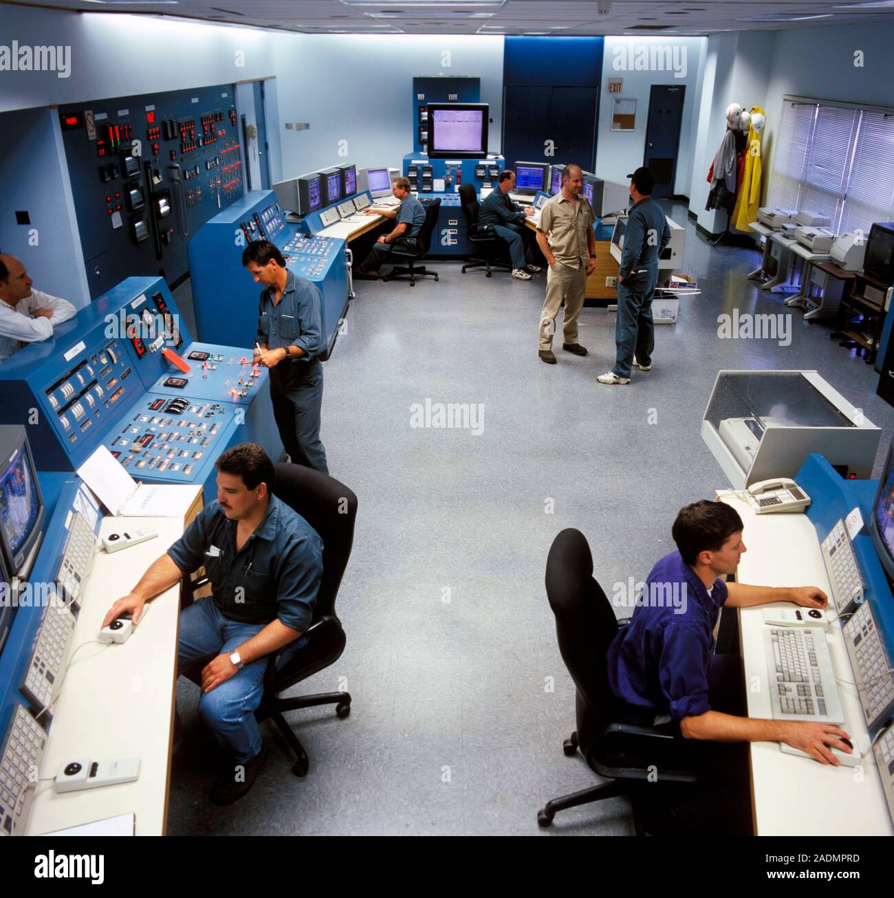 Power station control room. Technicians in the control room of a coal ...
