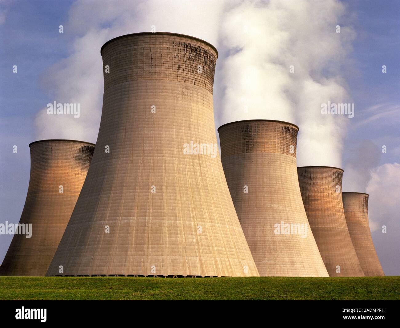 Cooling towers of a coal-fired power station emitting clouds of water ...