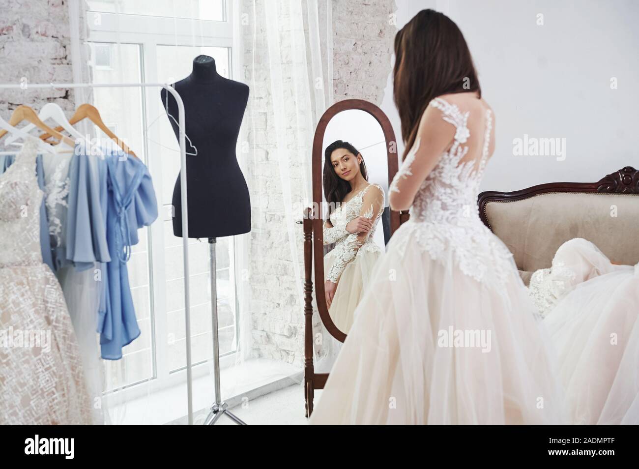 Evaluates the new design. The process of fitting the dress in the ...
