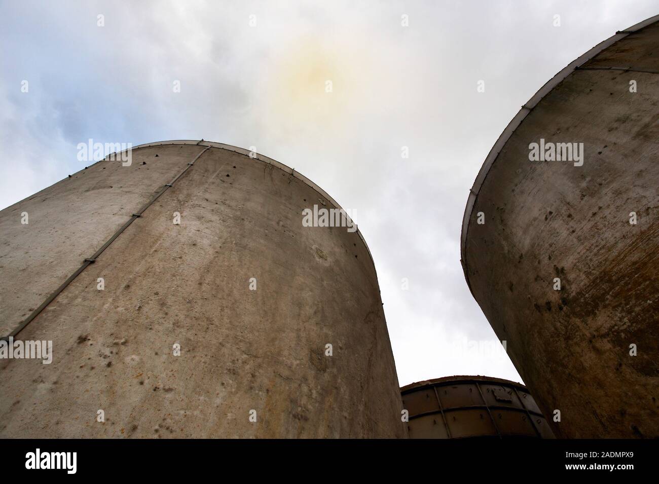 Coal-fired power station chimney. View looking upwards at the top of ...