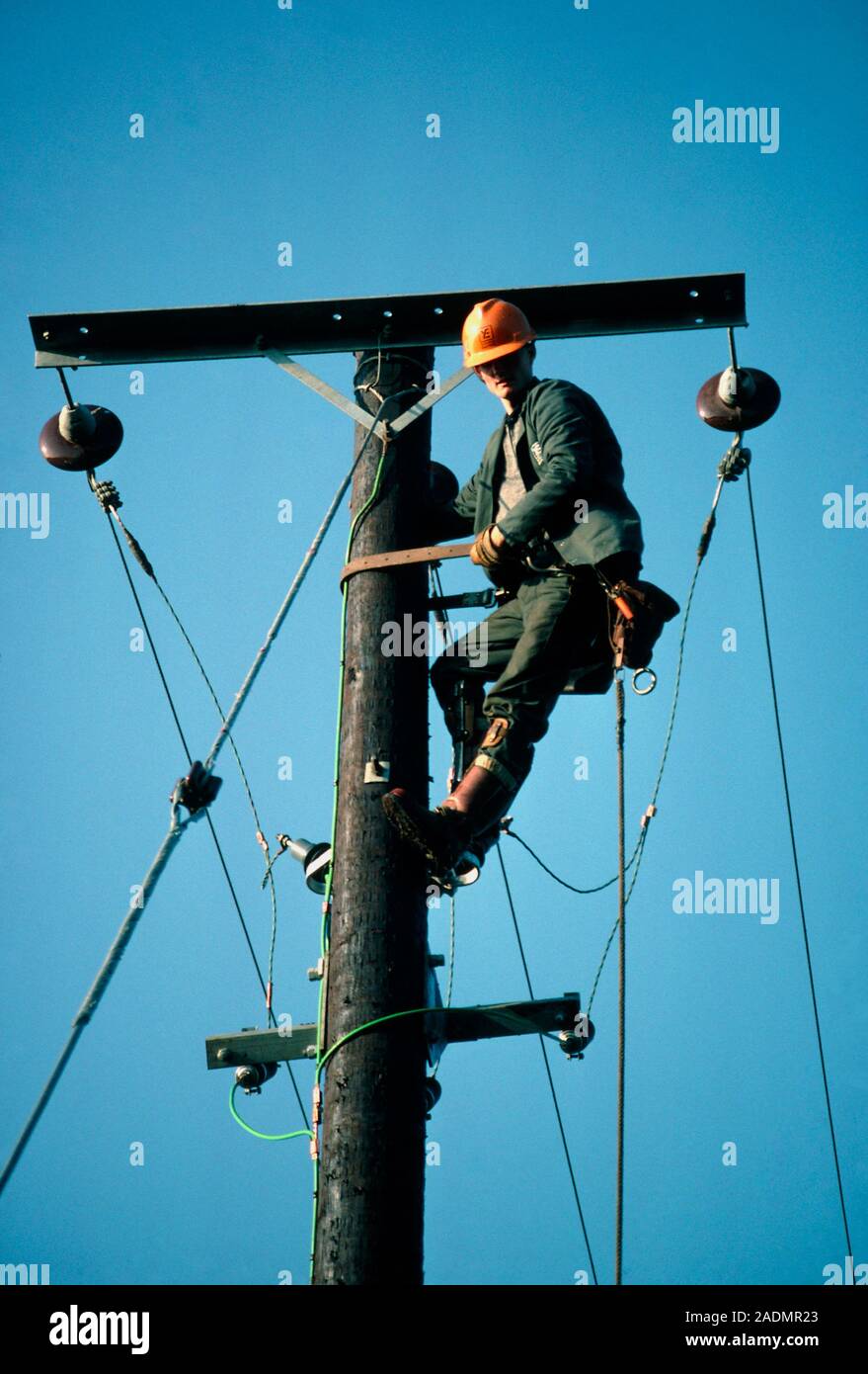 An engineer working on electricity power lines Stock Photo - Alamy