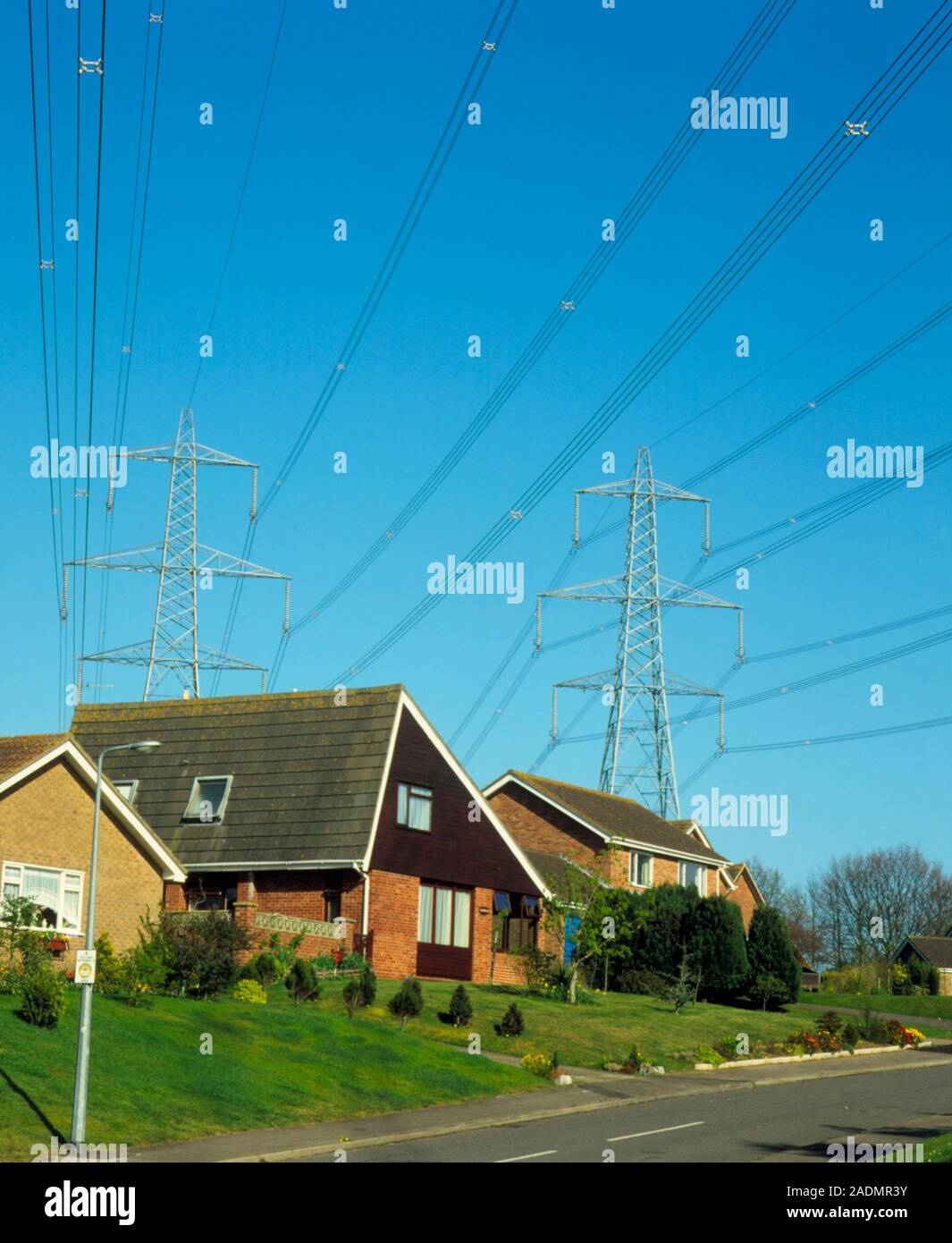 Power lines. Power lines passing directly over people's homes. Power ...