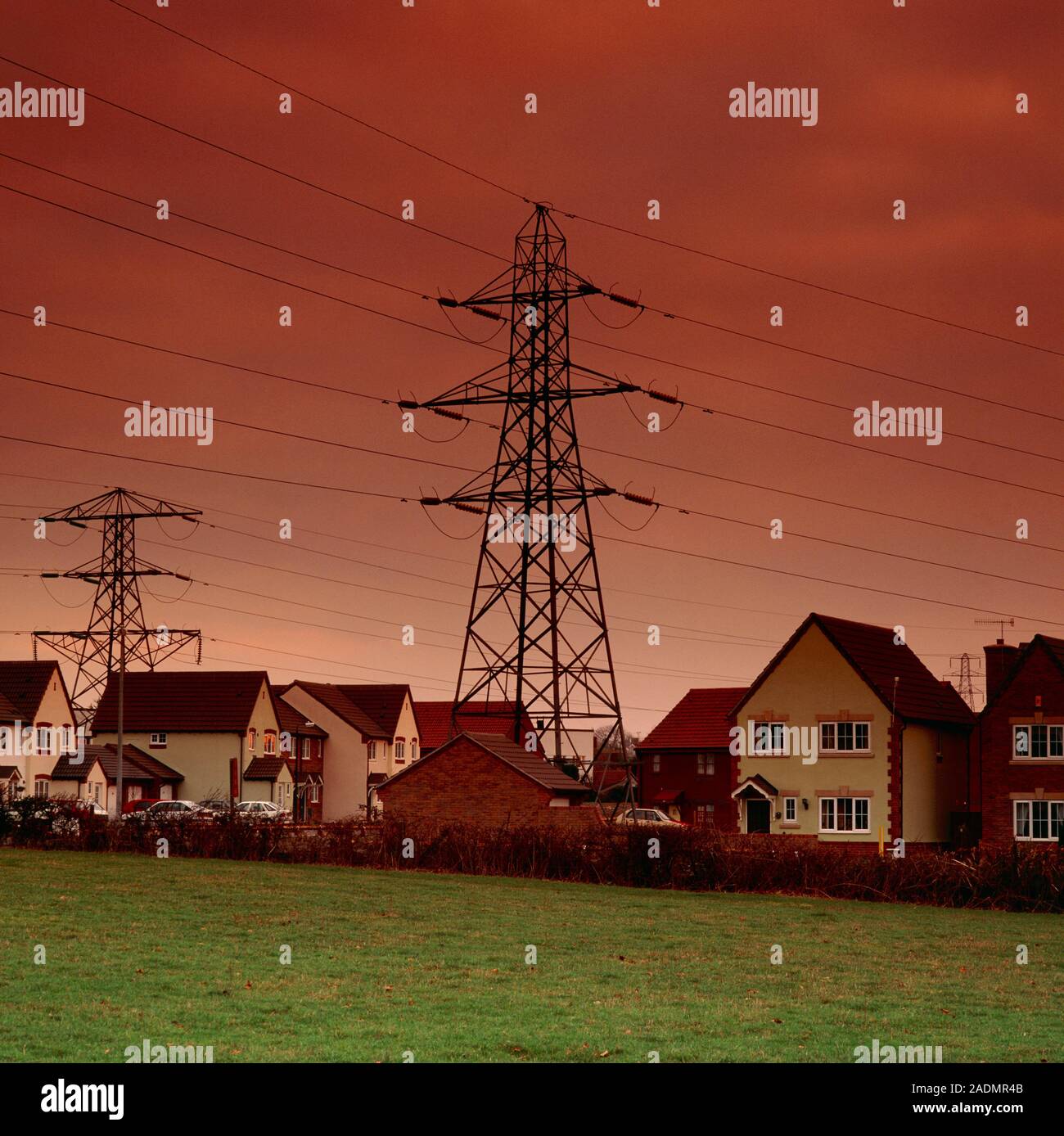 Power lines. Power lines passing directly over a housing estate. Power ...