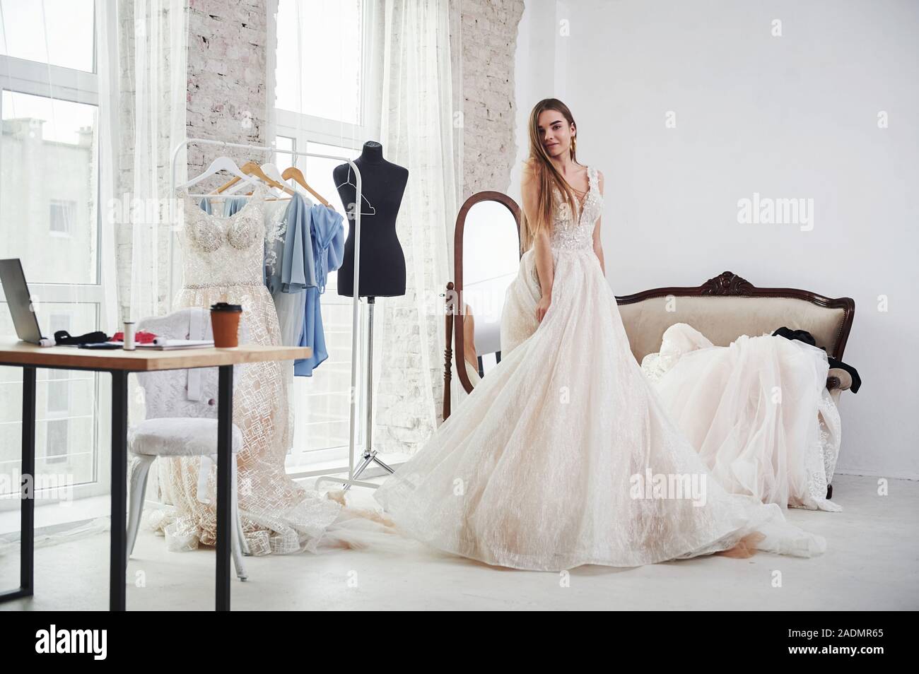 Luxury wear. The process of fitting the dress in the studio of hand ...