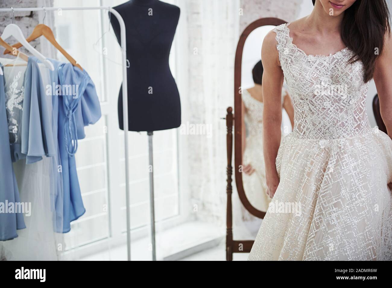 Particle view. The process of fitting the dress in the studio of hand ...