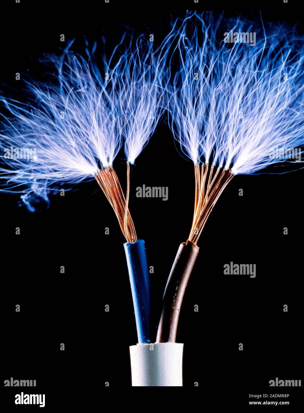 Electrical wires. Sparks coming from exposed electrical wires. Seen ...
