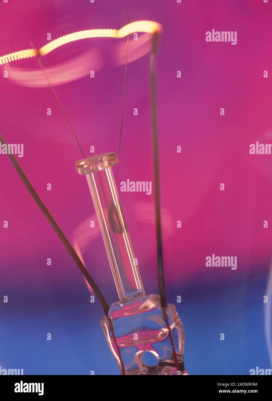 Light bulb filament. Electric current passing through the tungsten ...