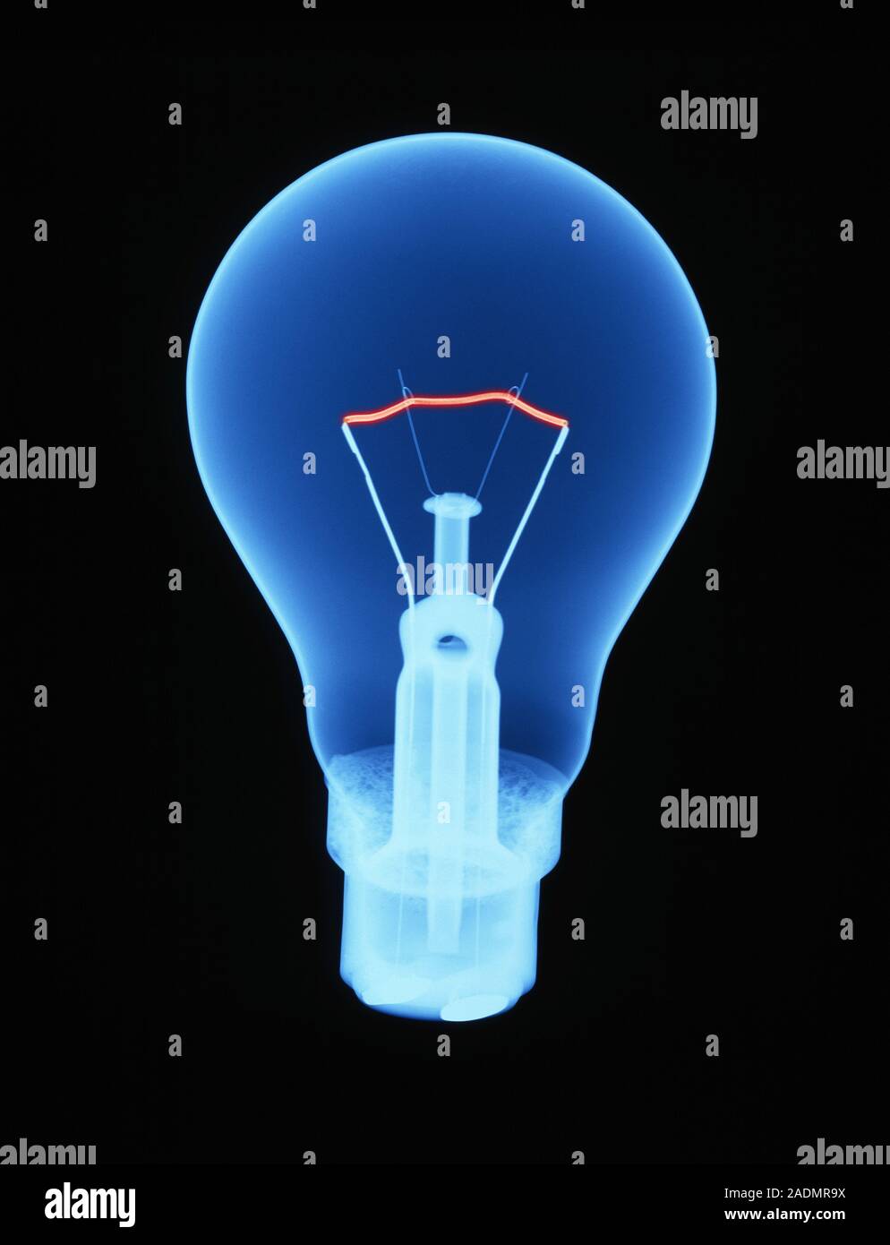 Light bulb. Coloured X-ray of a light bulb. It produces light from a ...