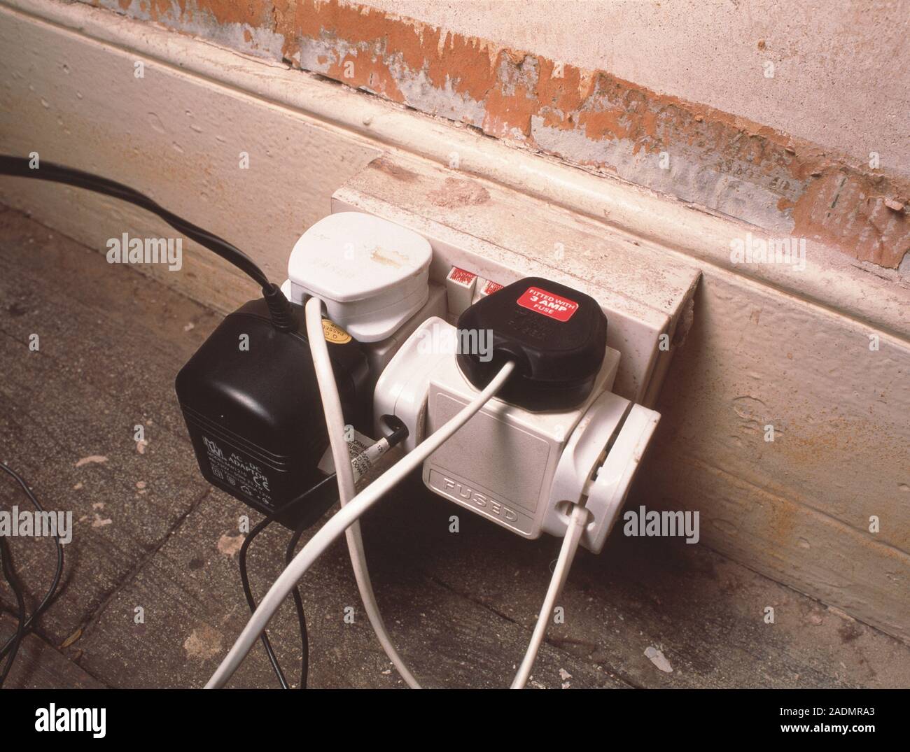 Electrical plugs in sockets Stock Photo - Alamy