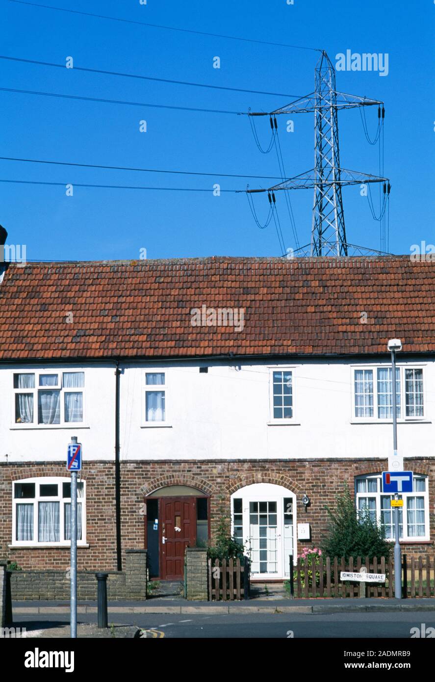 Electricity pylon. Power lines from an electricity pylon passing over a ...
