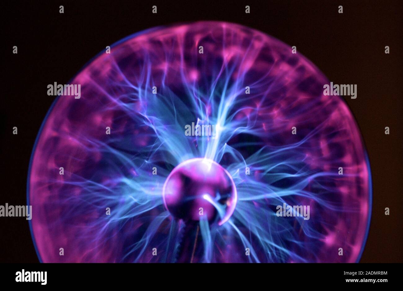 Plasma globe. Streamers of light inside a plasma globe. This device ...