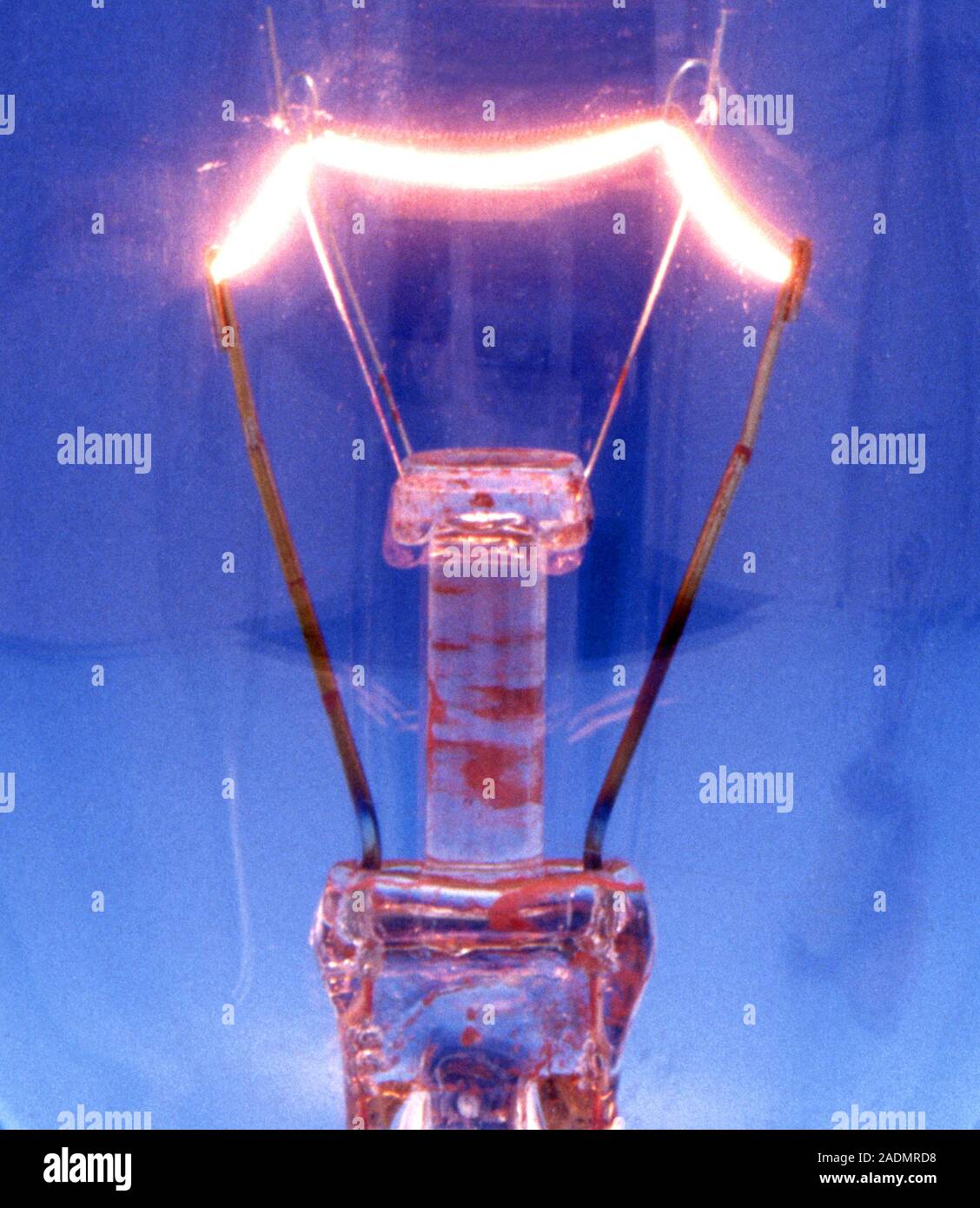 Glowing light bulb filament Stock Photo - Alamy
