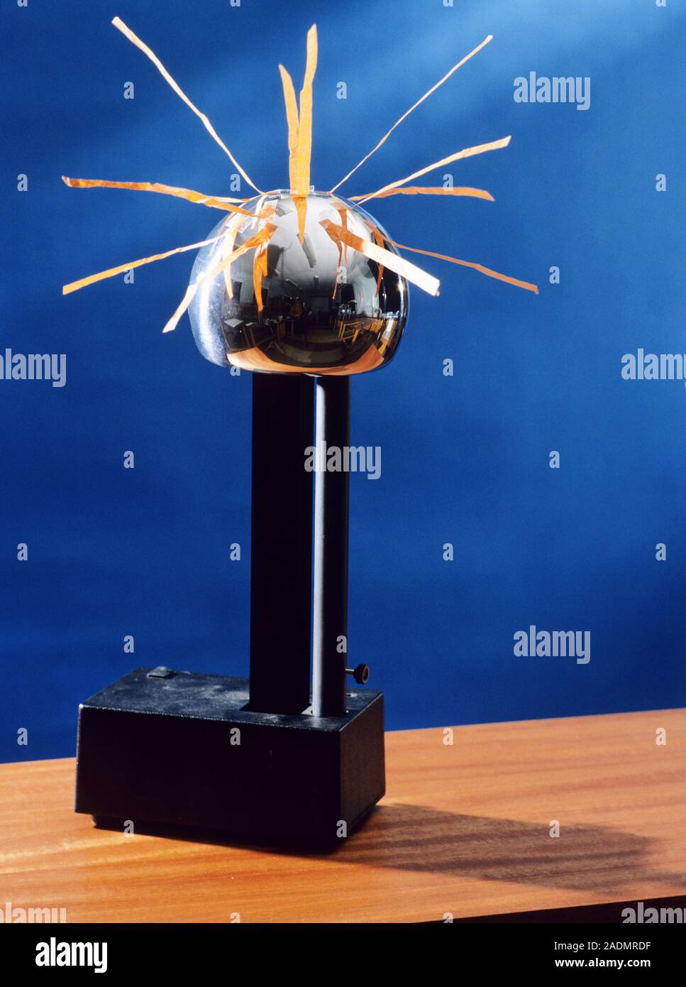 Static electricity. Strips of paper that have been electrically charged ...