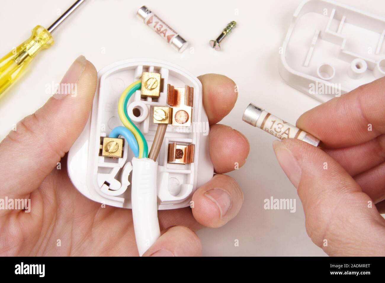 Changing plug fuse. Fuses are designed to protect electrical devices ...