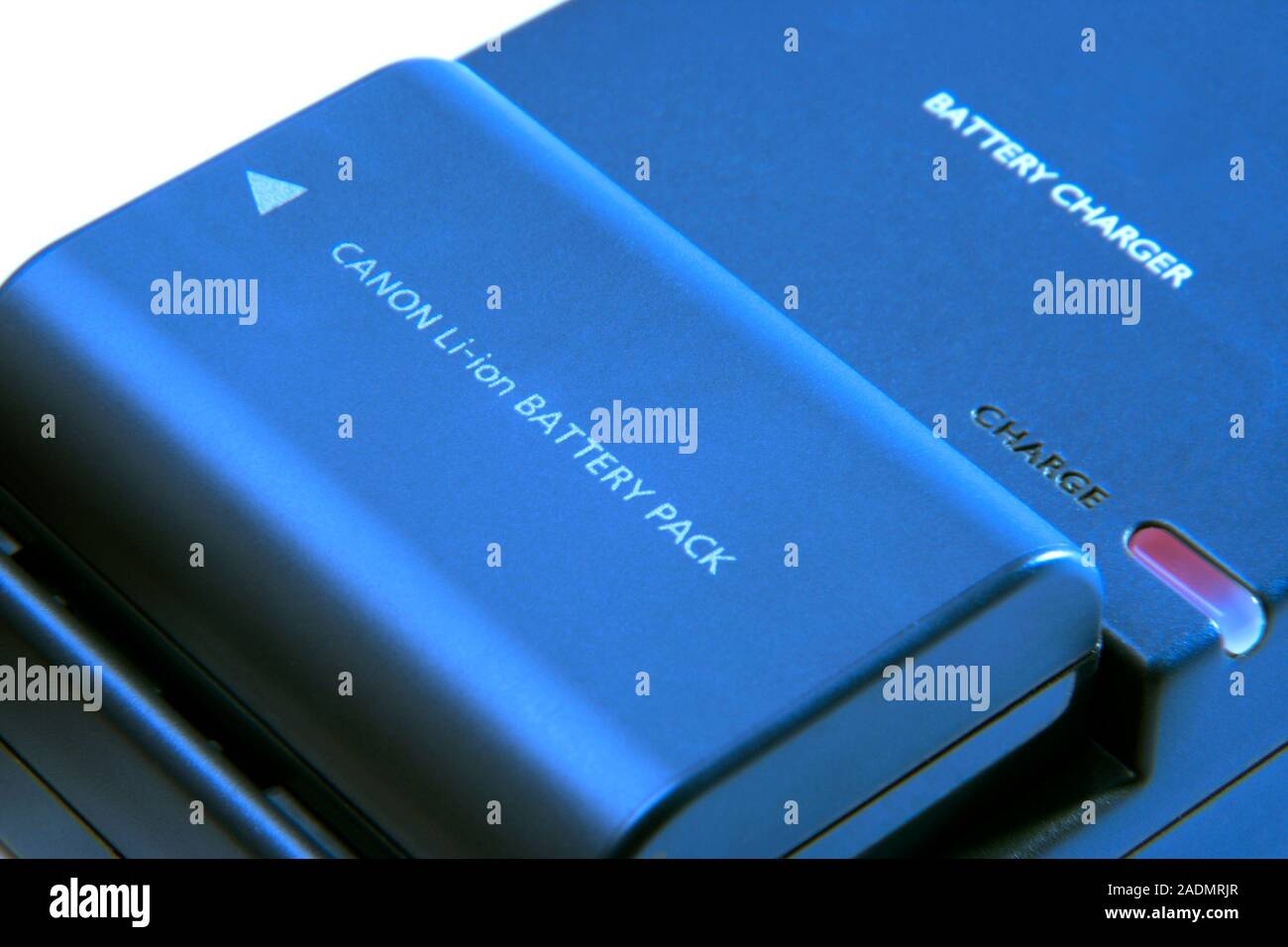 Lithium-ion battery. This is a rechargeable battery in its charger. The ...