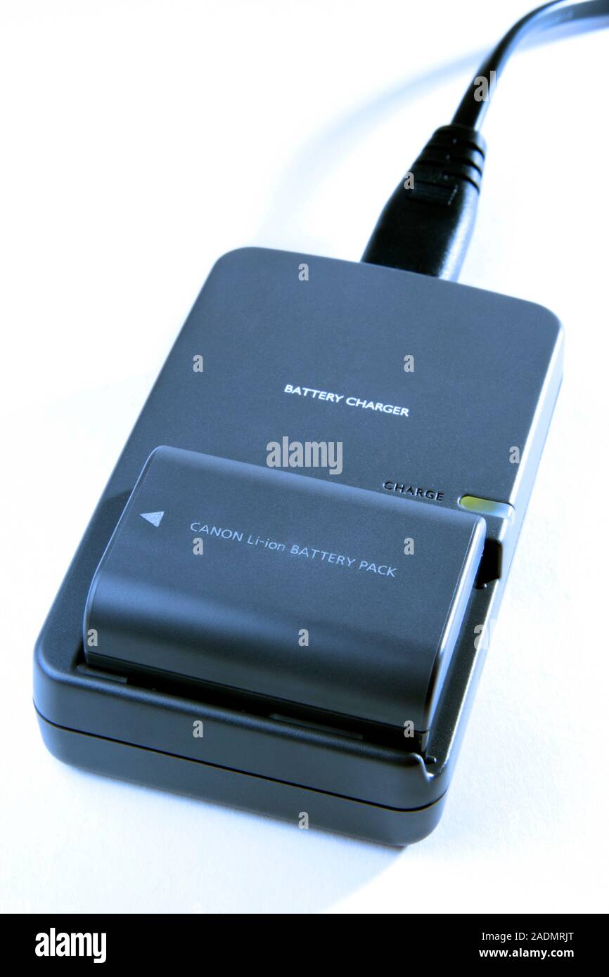 Lithium-ion battery. This is a rechargeable battery in its charger. The ...
