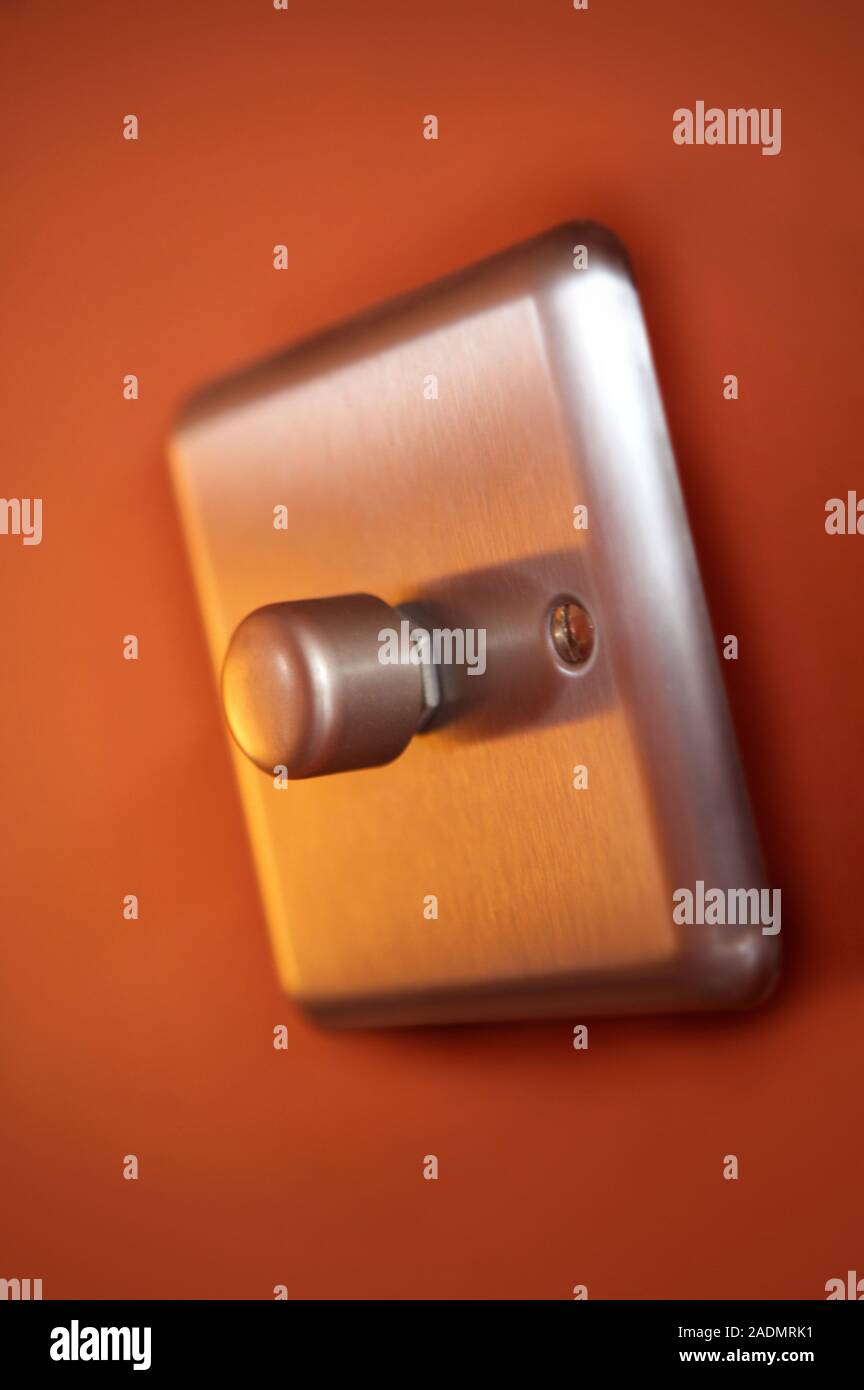 Dimmer switch to control electrical lighting Stock Photo - Alamy