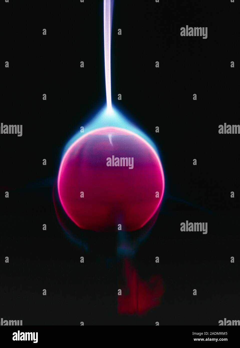 Plasma globe. The central metal orb inside the glass sphere of a plasma ...