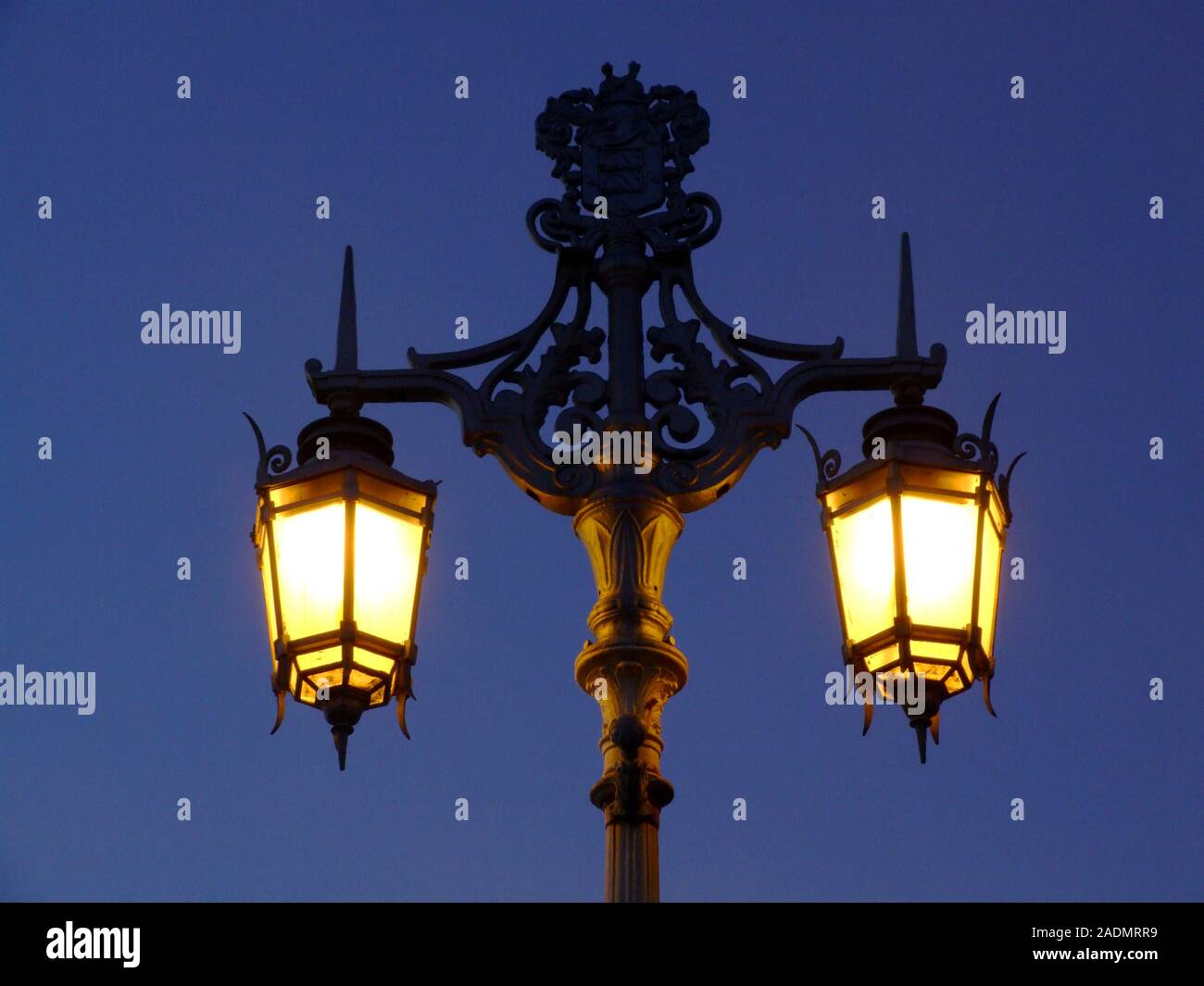 Street lighting. 19th-century cast-iron lamp post with 1930s electric ...