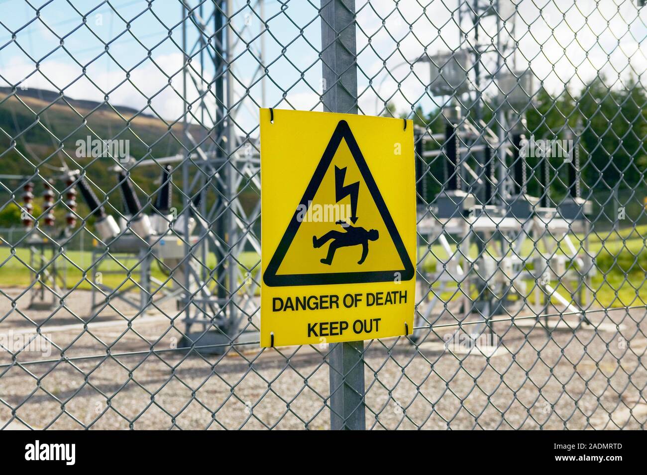 Hydroelectric power substation showing a 'danger of death' warning sign ...