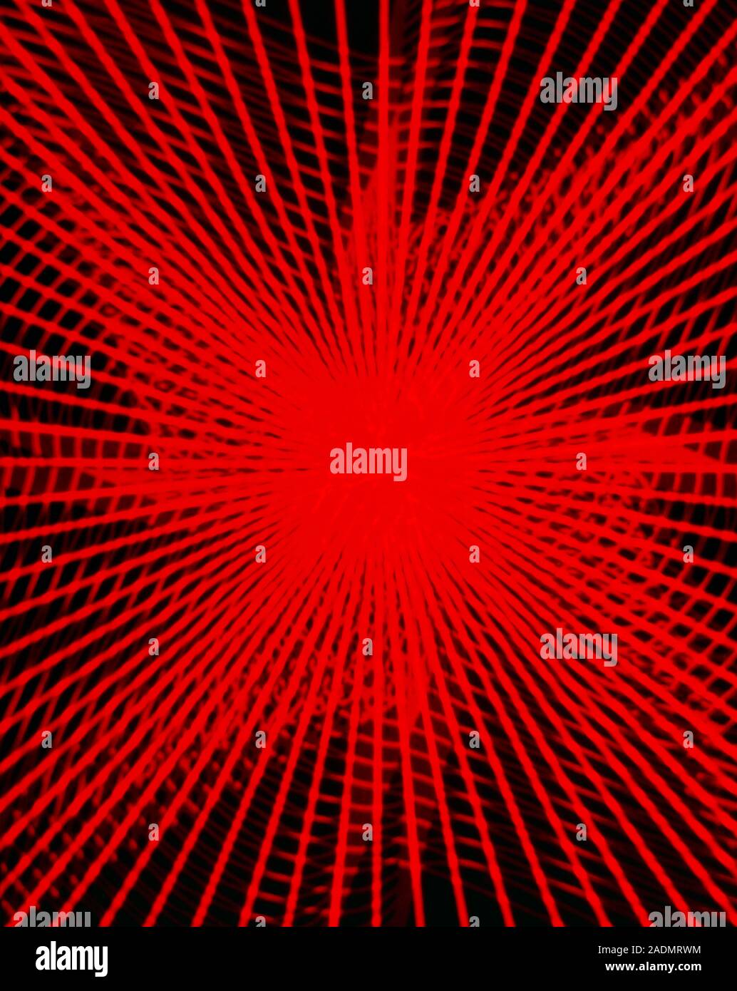 Laser. A brilliant pattern of red light, created by an oscillating ...