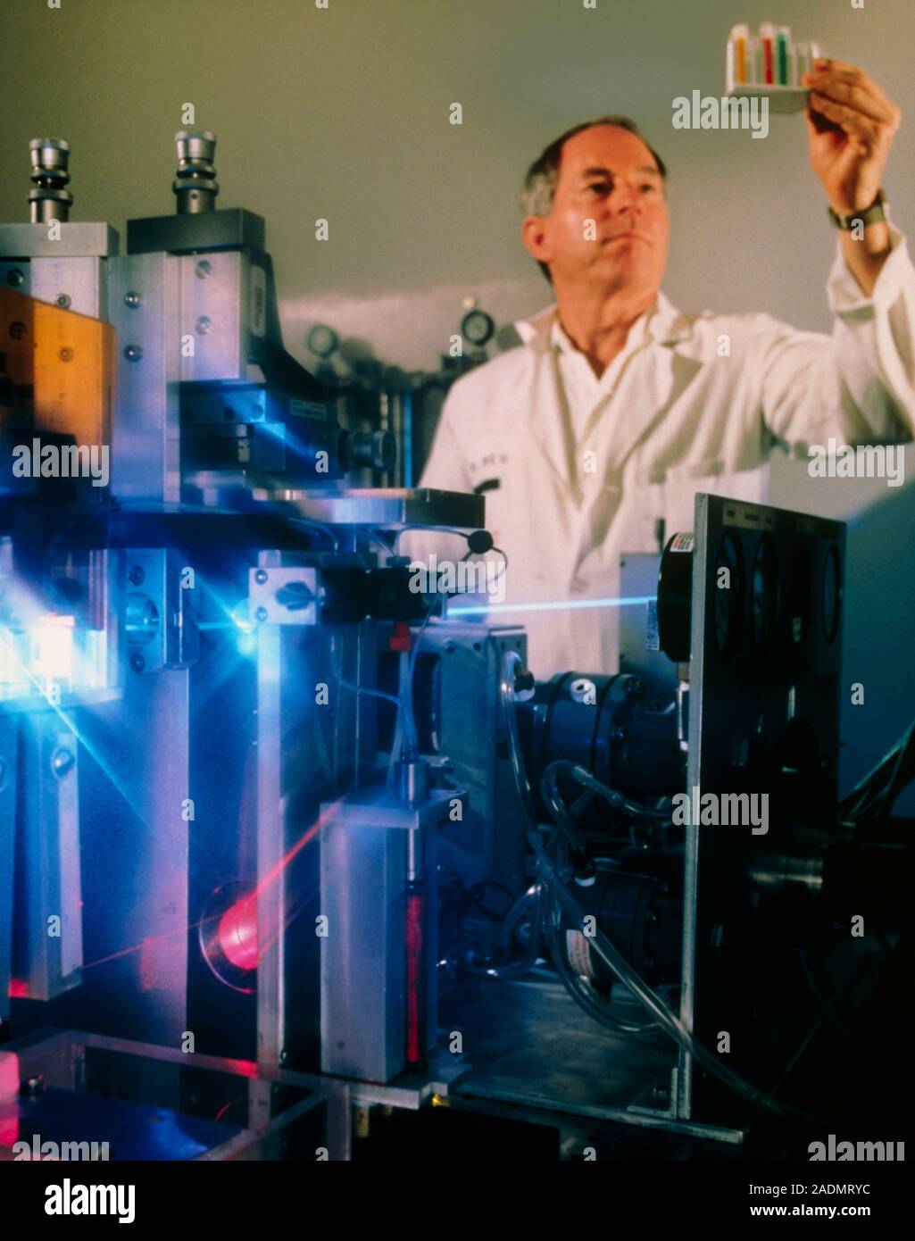 Biotechnology equipment. View of the laser beams in a flow cytometer, a ...